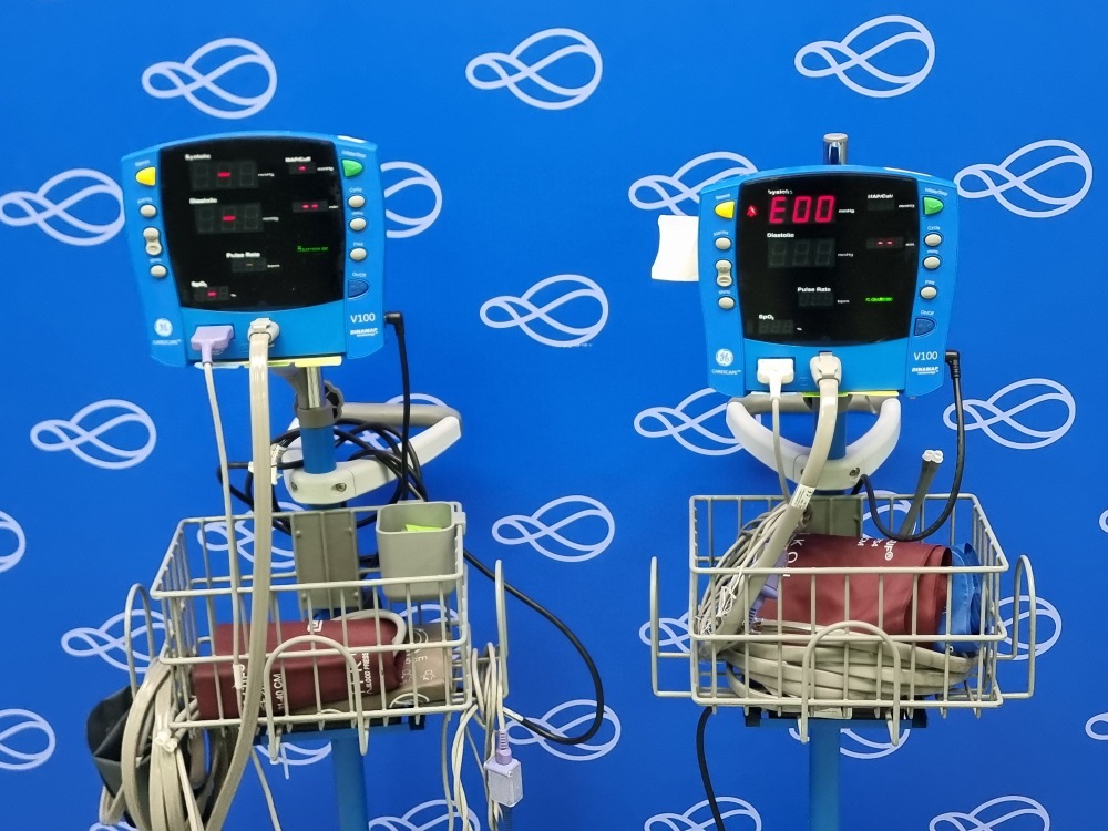 2 x GE Dinamap V100 Vital Signs Monitor on Rollstand
