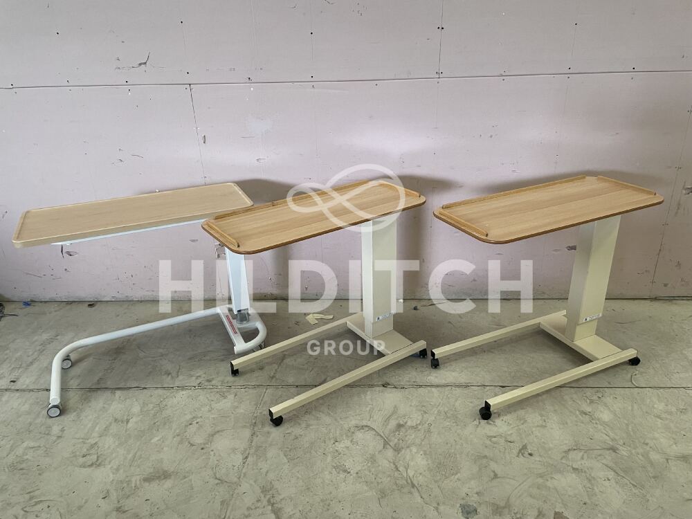 2 x Huntleigh Nesbit Evans & 1 x Sunflower Medical Overbed Tables