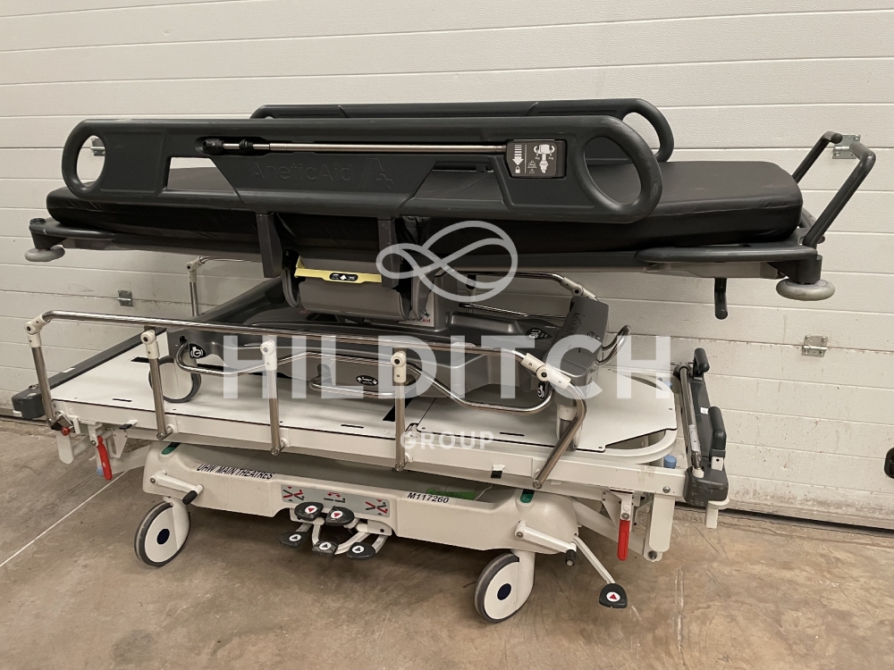 1 x Anetic Aid QA3 & 1 x Arjo Huntleigh Lifeguard Patient Trolleys